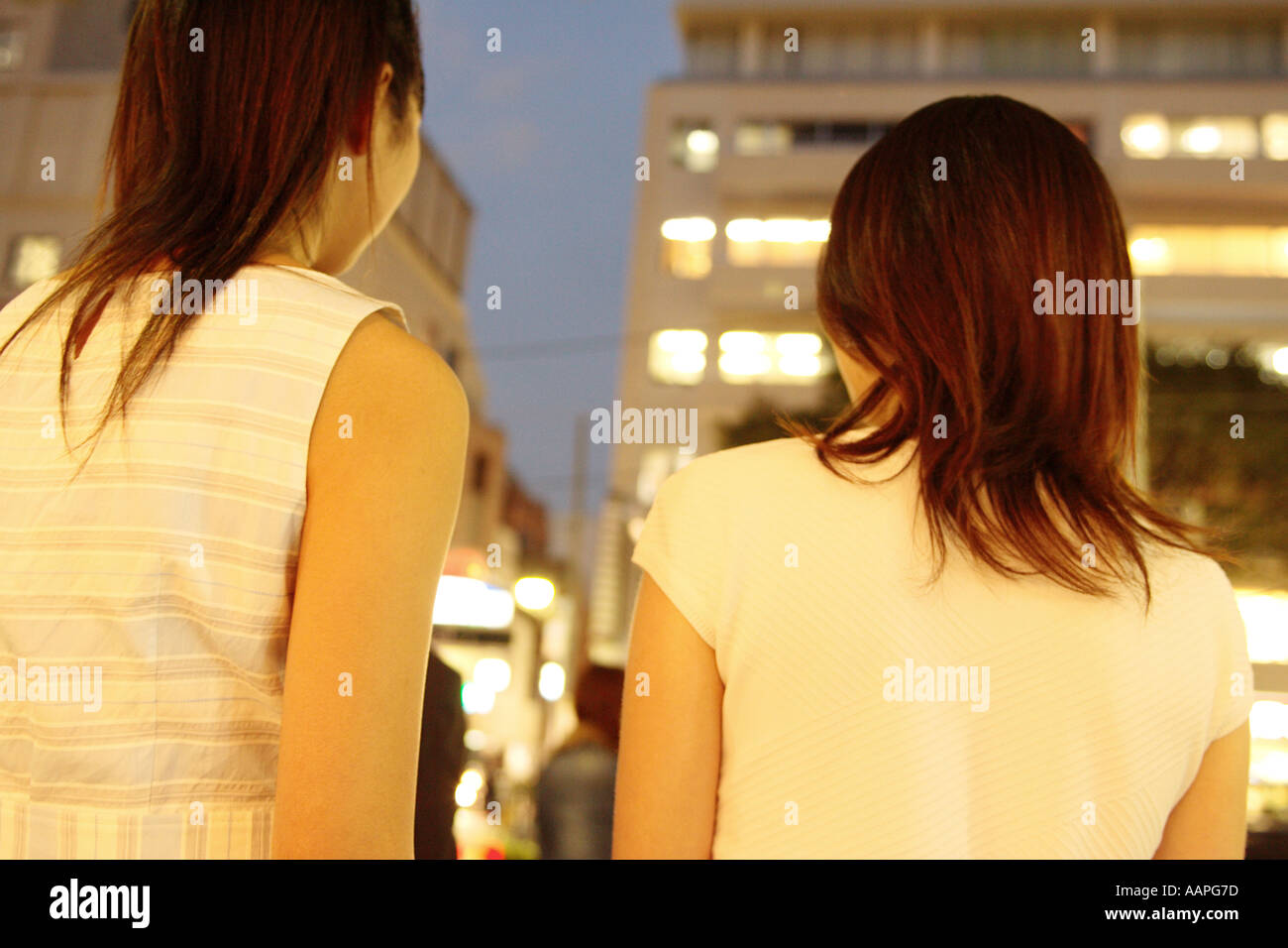 Back view two walking hi-res stock photography and images - Alamy