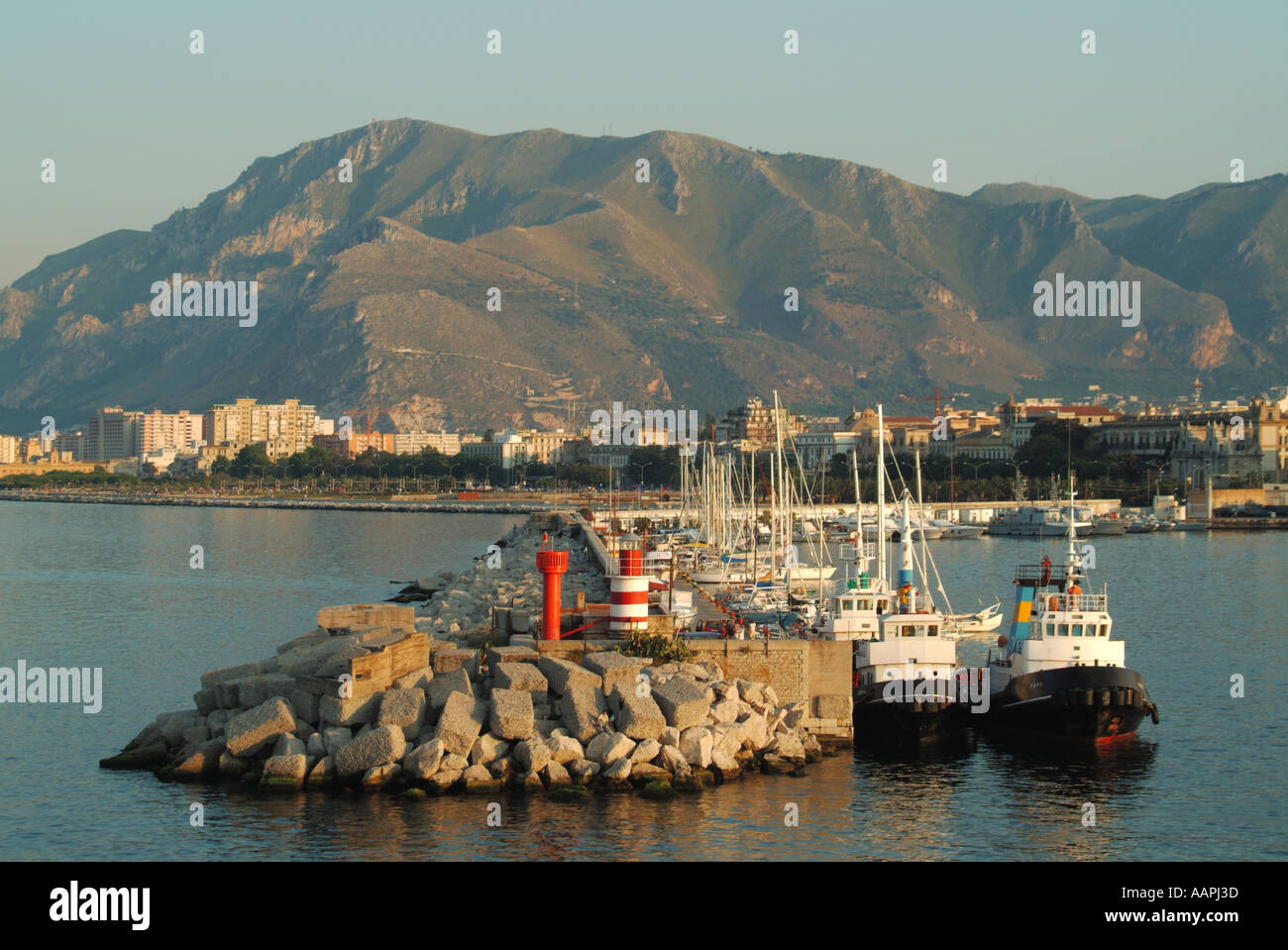Palermo Sicily port and coastline beyond harbour walls Stock Photo - Alamy