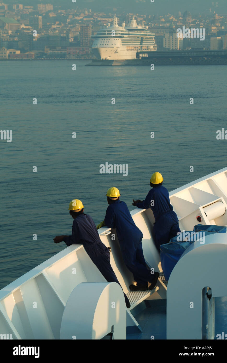 Naples port cruise ship early morning misty arrival with crew ready on ...