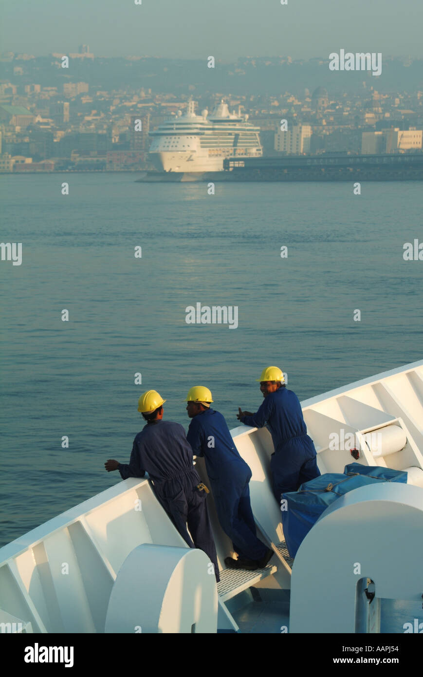 Naples port cruise ship early morning misty arrival with crew ready on ...