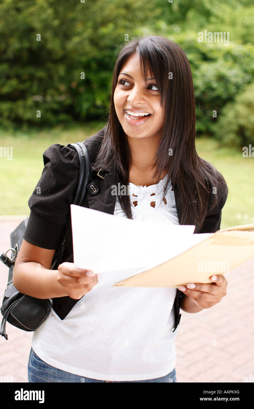 Ethnic girl sat with exam results Stock Photo - Alamy