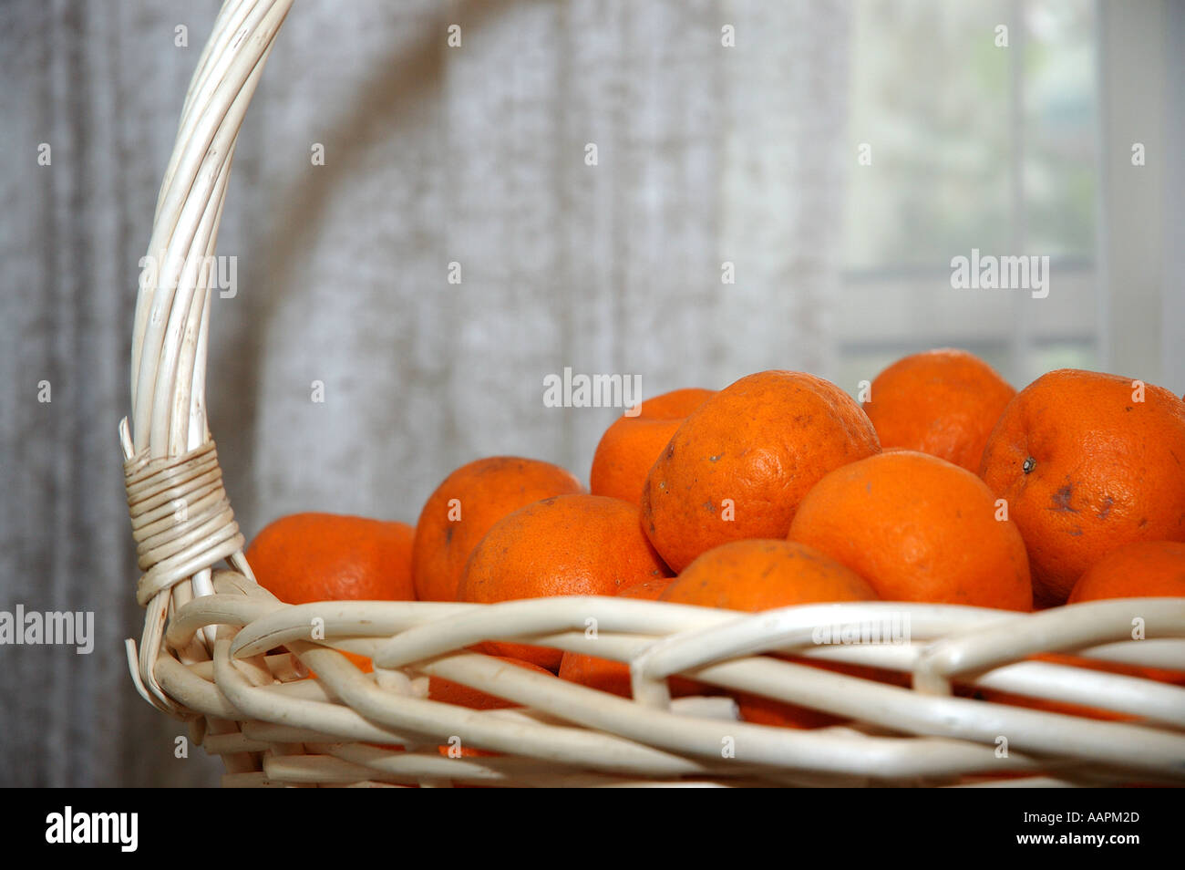 Mandarin orange in a basket Stock Photo - Alamy