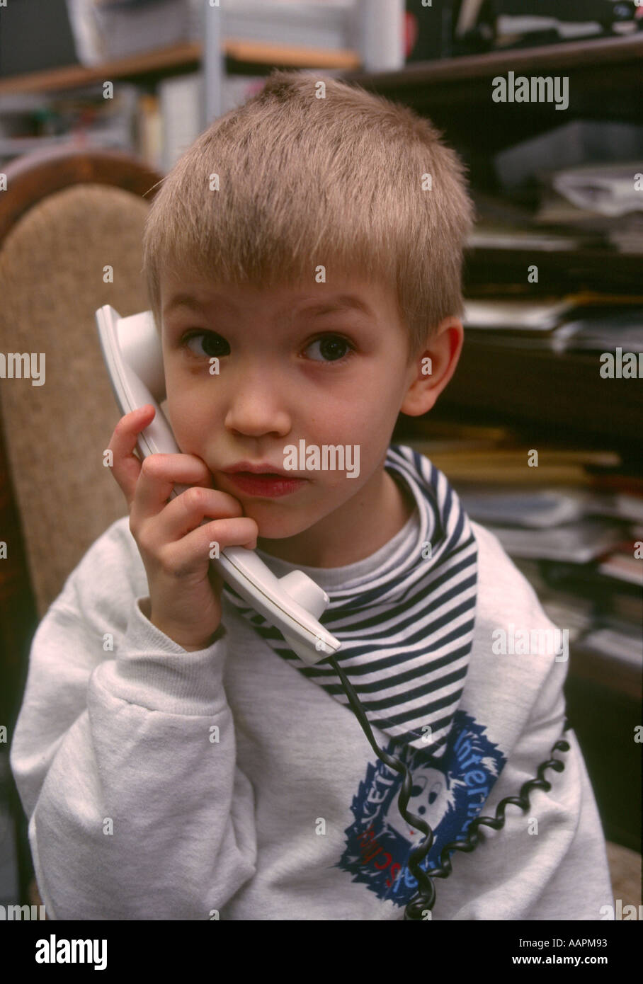 Boy is making a phone call Stock Photo - Alamy