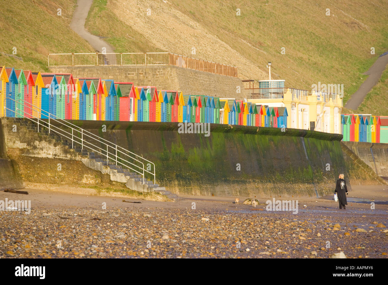 coloured beach huts on whitby seafront Stock Photo - Alamy