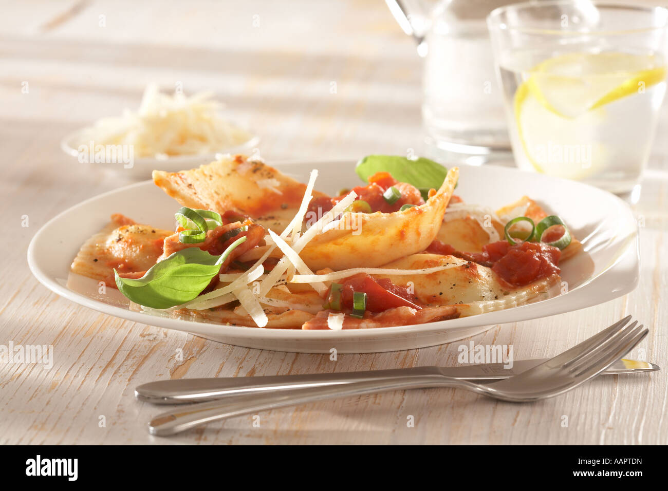 Basil Ravioli with Tomato Sauce Stock Photo - Alamy