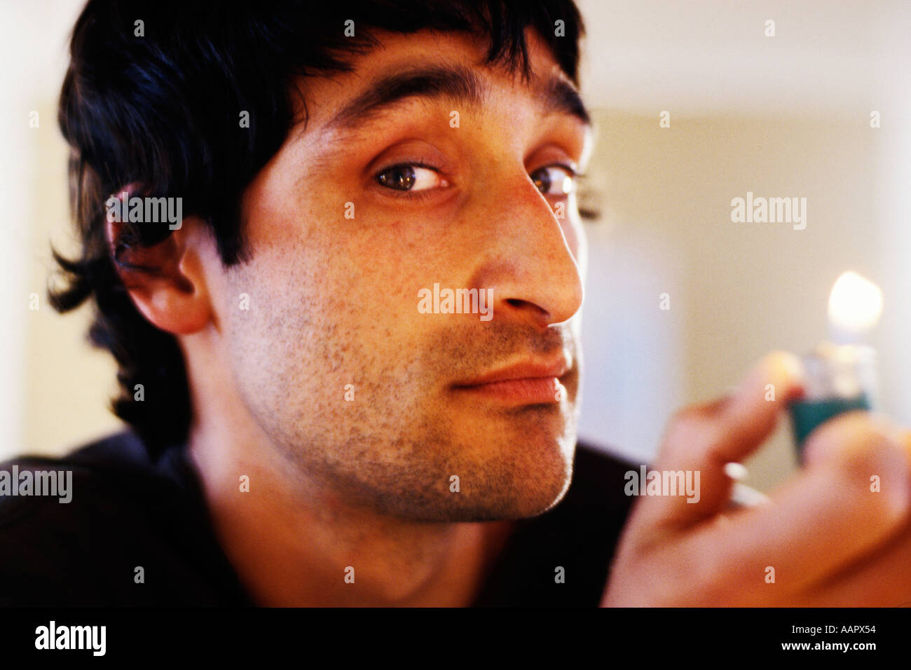 Portraits, Man with lighter Stock Photo - Alamy