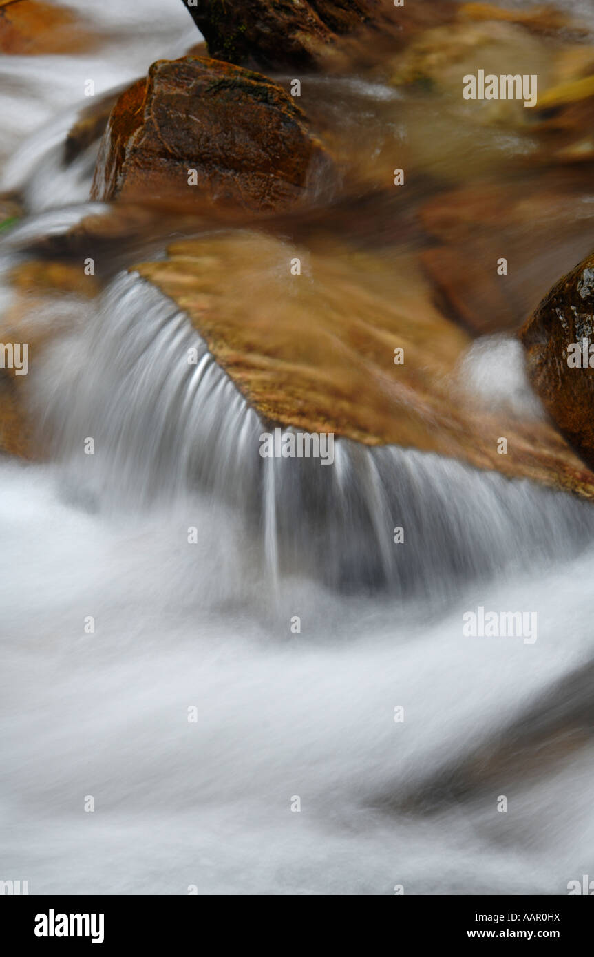 Water flowing over rocks on the River Avill in Snow Drop Valley near ...