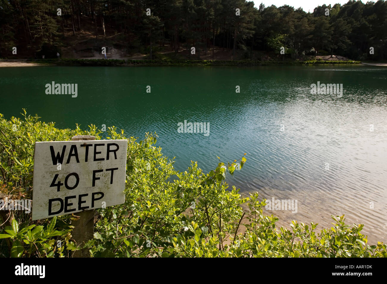 Deep water Warning danger sign at the Blue Pool Wareham Dorset UK Stock ...