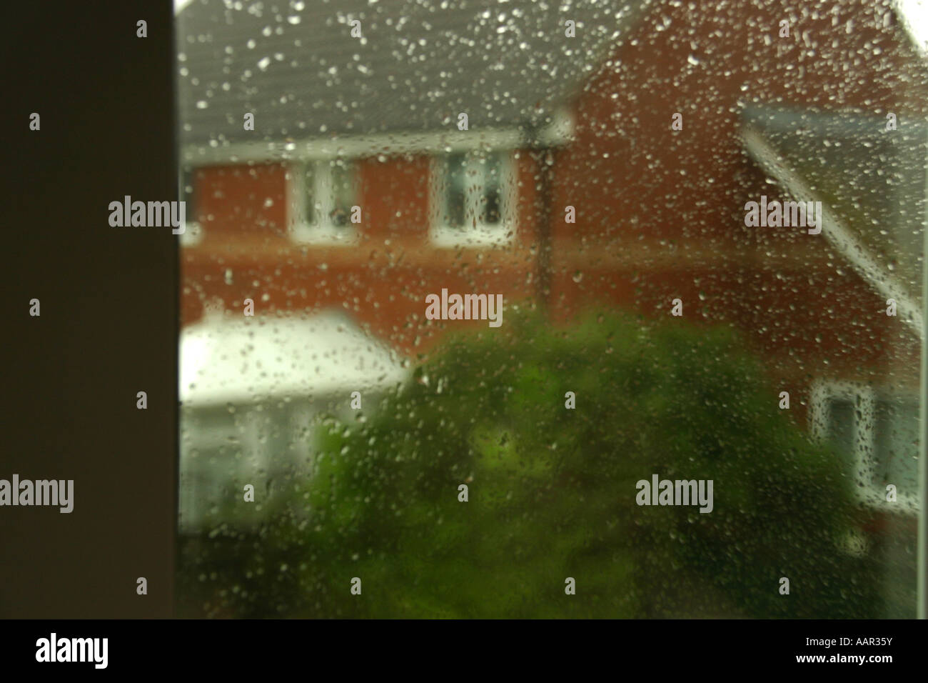 View of house through rain streaked window Stock Photo - Alamy