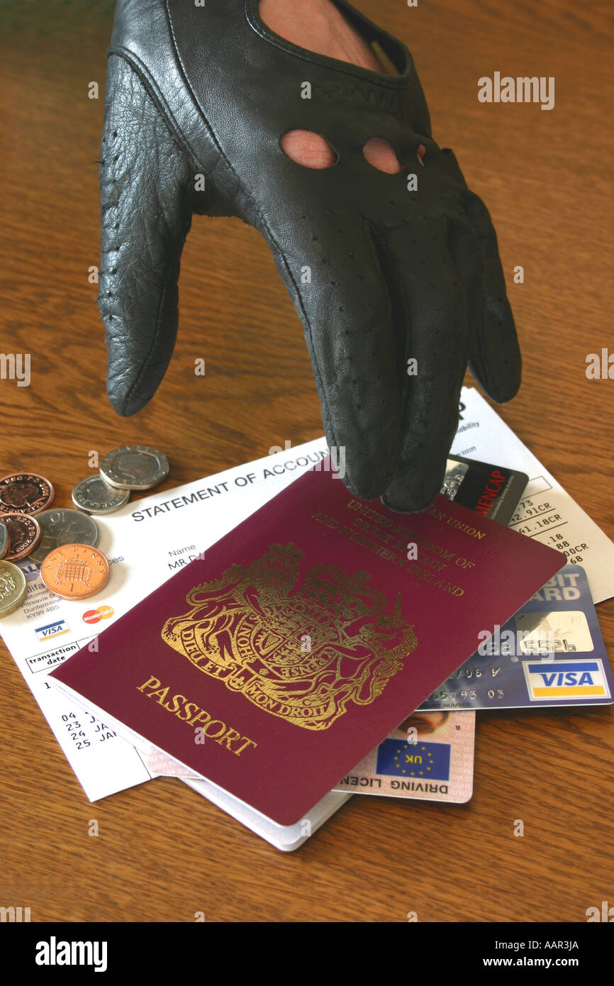 Identity Theft concept - thief reaching for personal documents Stock ...