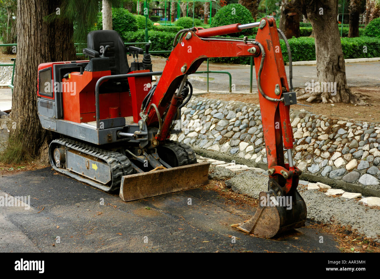 Red mini excavator machine Stock Photo - Alamy