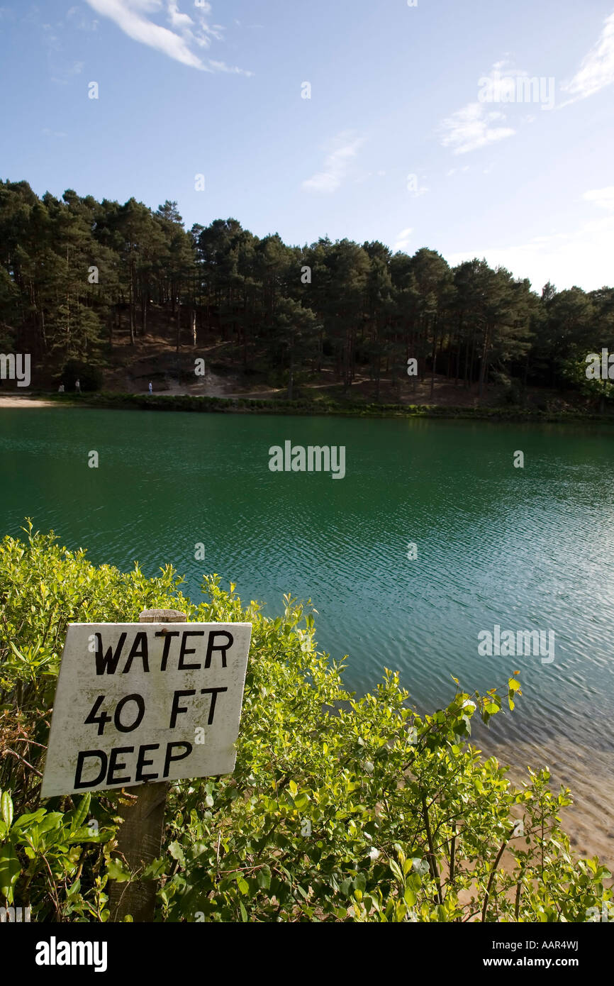 Deep water Warning danger sign at the Blue Pool Wareham Dorset UK Stock ...