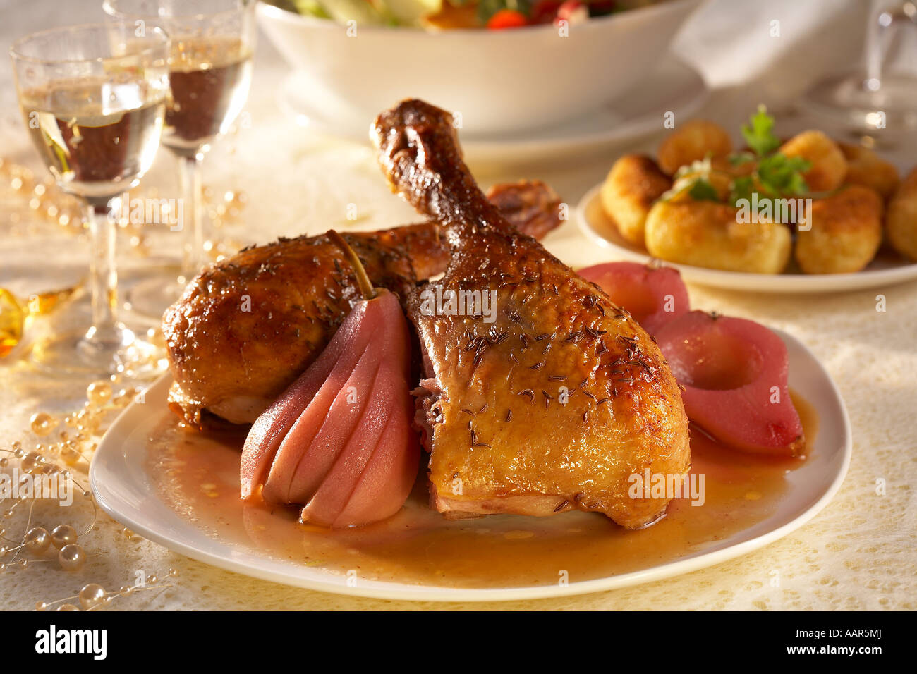 Goose Legs with Pears on Red Wine Stock Photo - Alamy