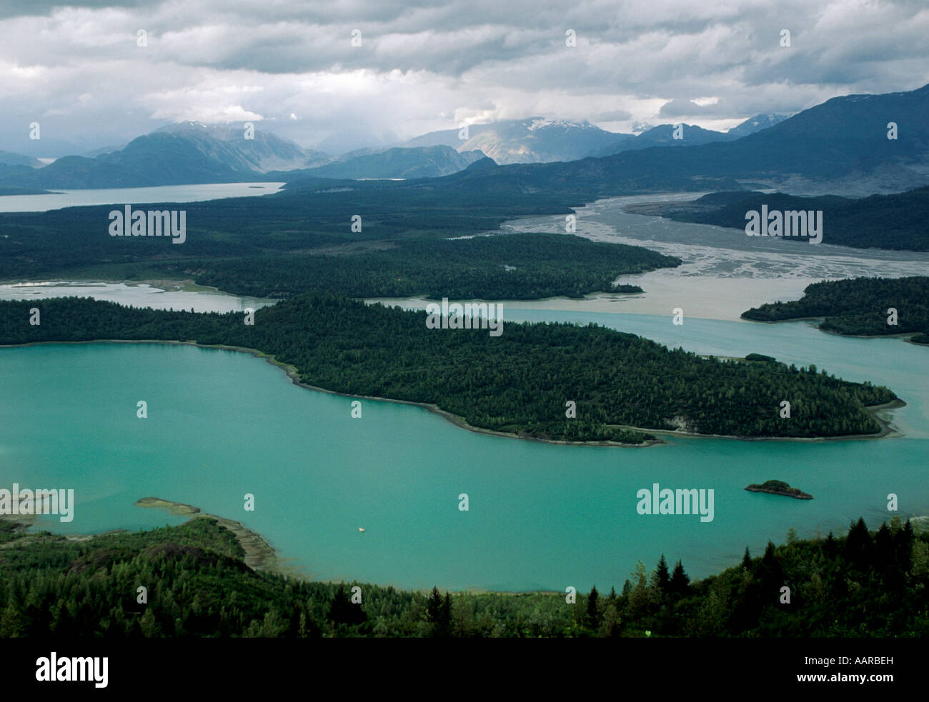 The reflective surface of ADAMS INLET surrounded by rugged terrain ...
