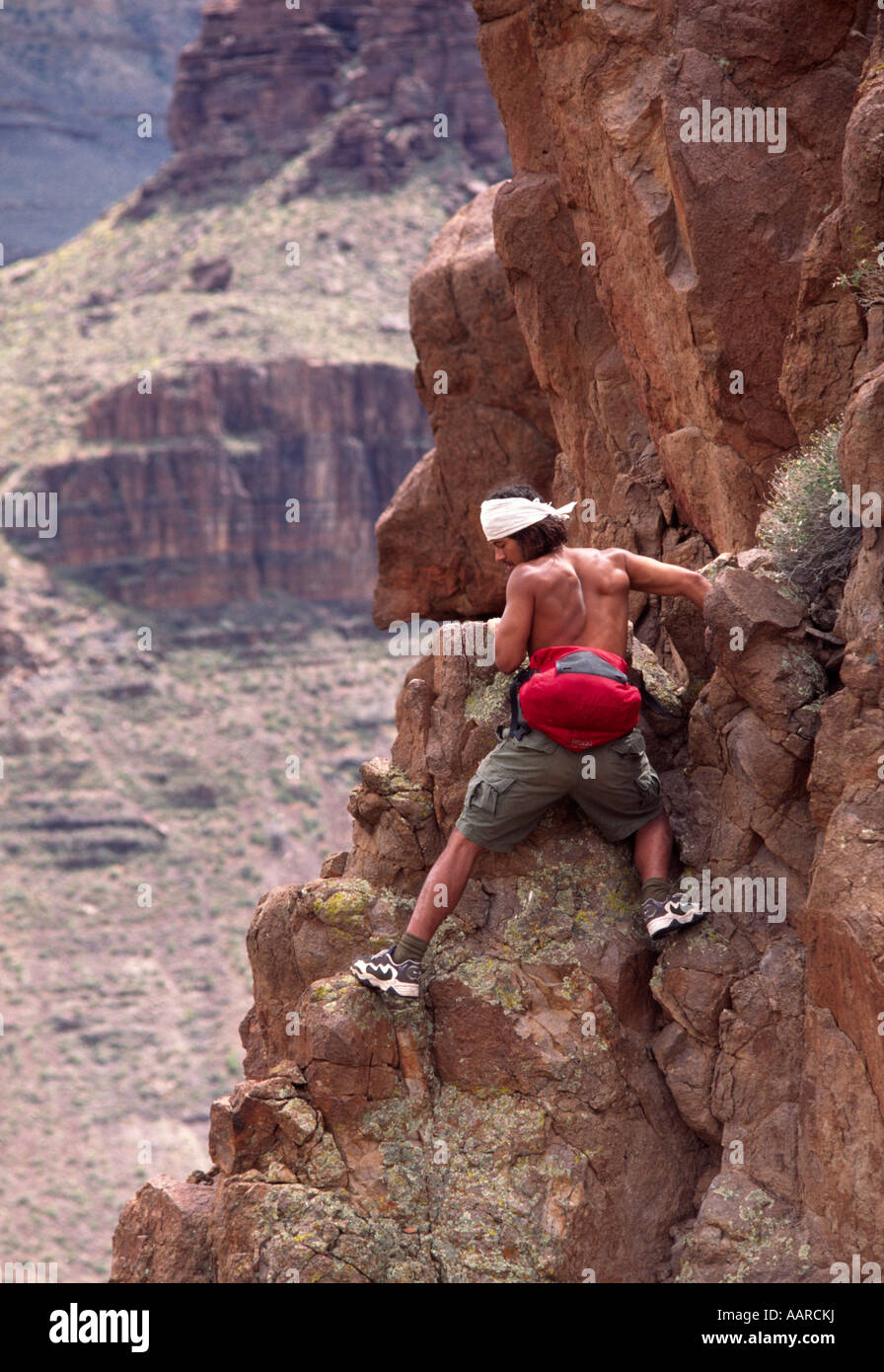 Matt Allen holds a rock above the TONTO PLATEAU near SHINUMO CREEK ...