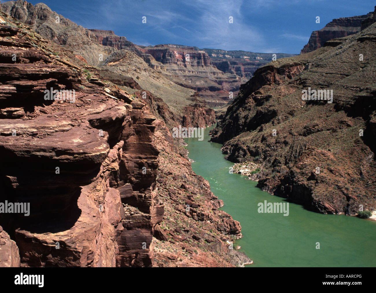The green waters of the COLORADO RIVER flow through the GRAND CANYON ...