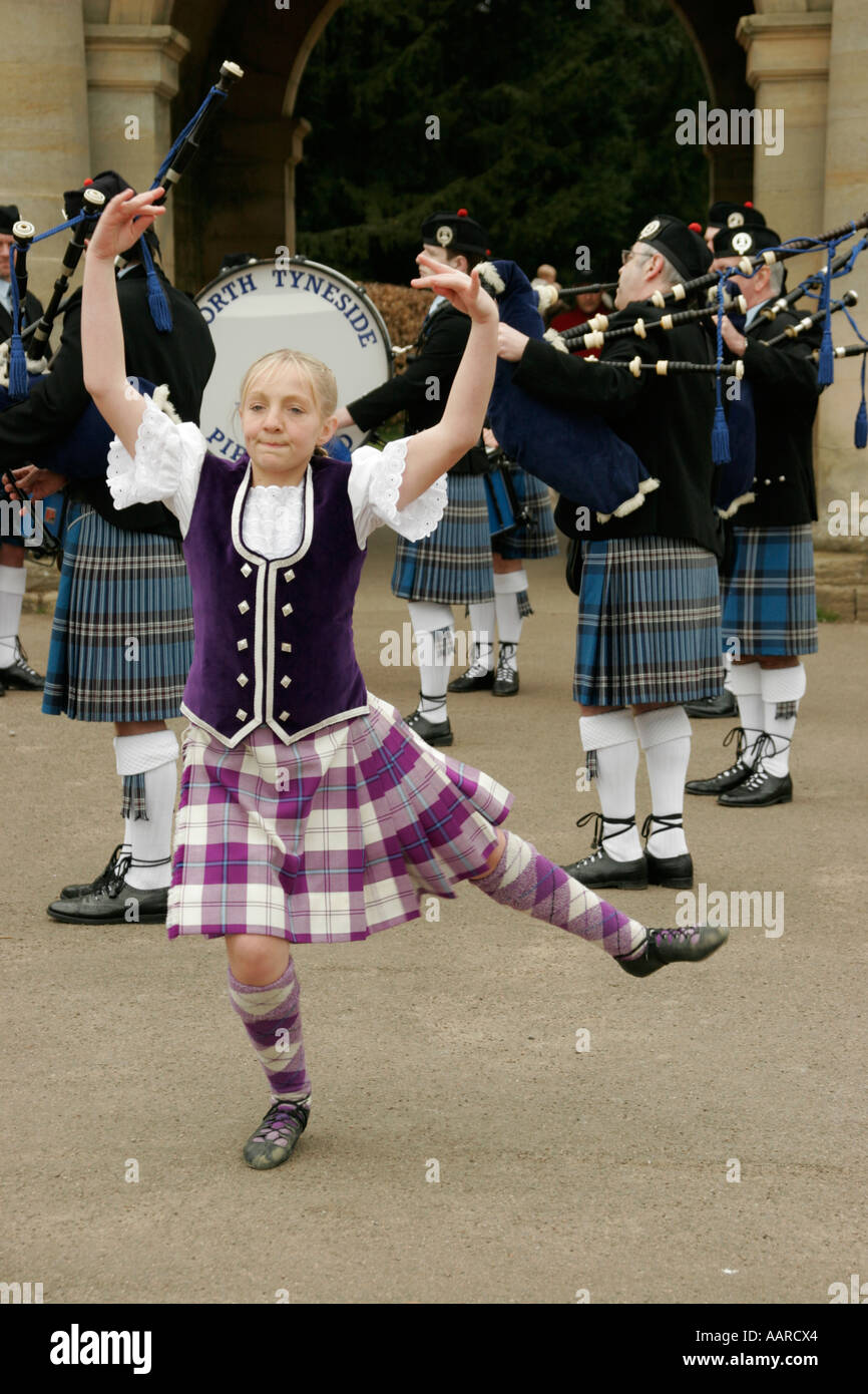 Highland dancer with pipe band Stock Photo - Alamy