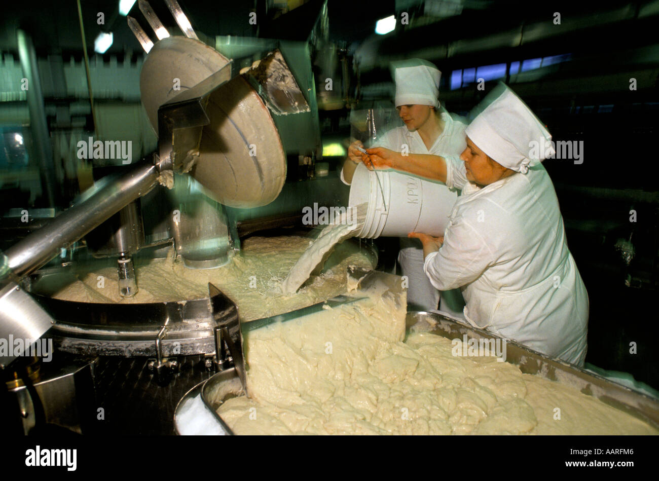 MURMANSK WOMEN WEARING OVERALLS WORKING INSIDE A FISH FACTORY RUSSIA ...