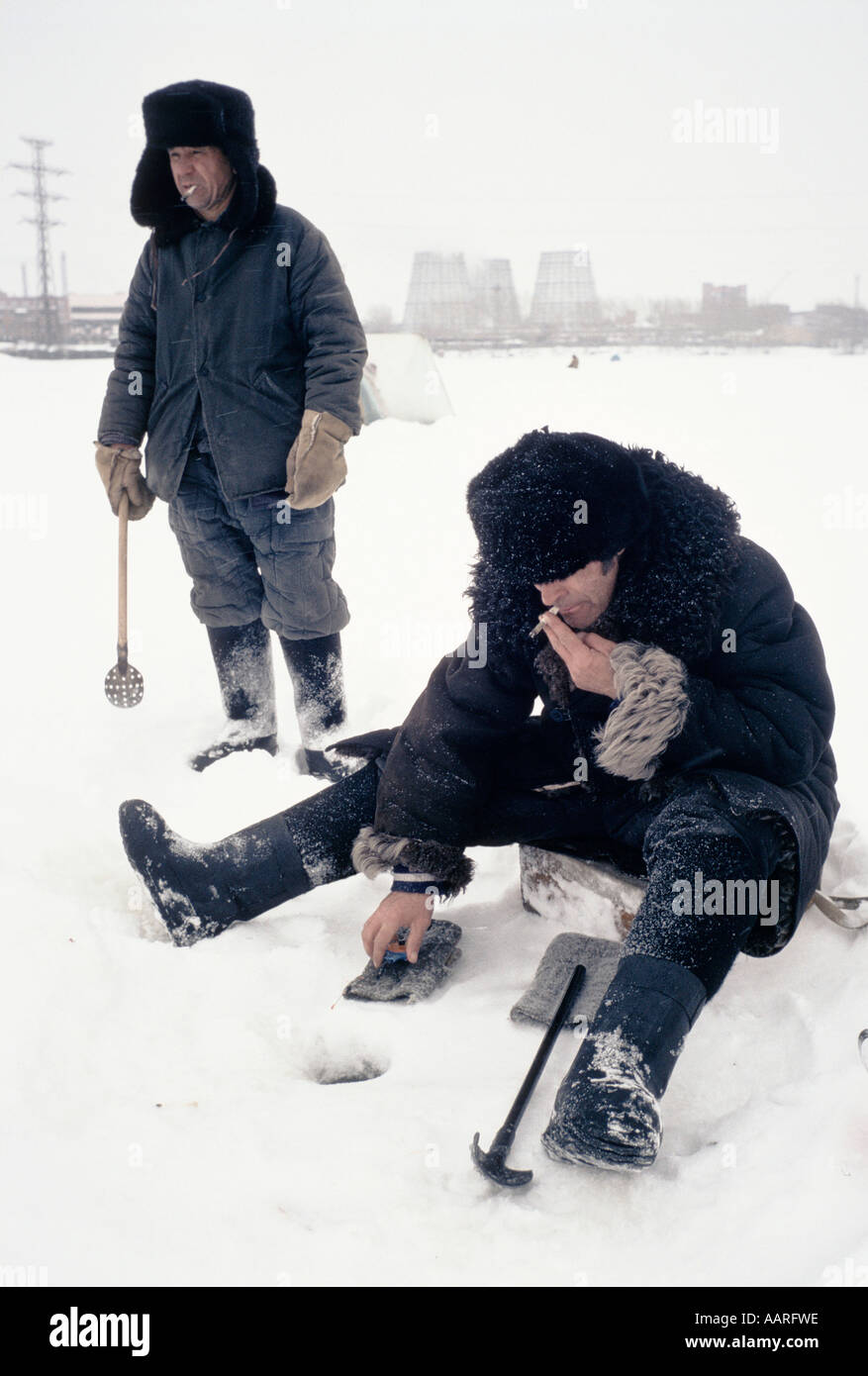 SVERDLOVSK MARCH 1991 MEN SMOKING CIGARETTES FISH IN SNOW FROM SMALL ...