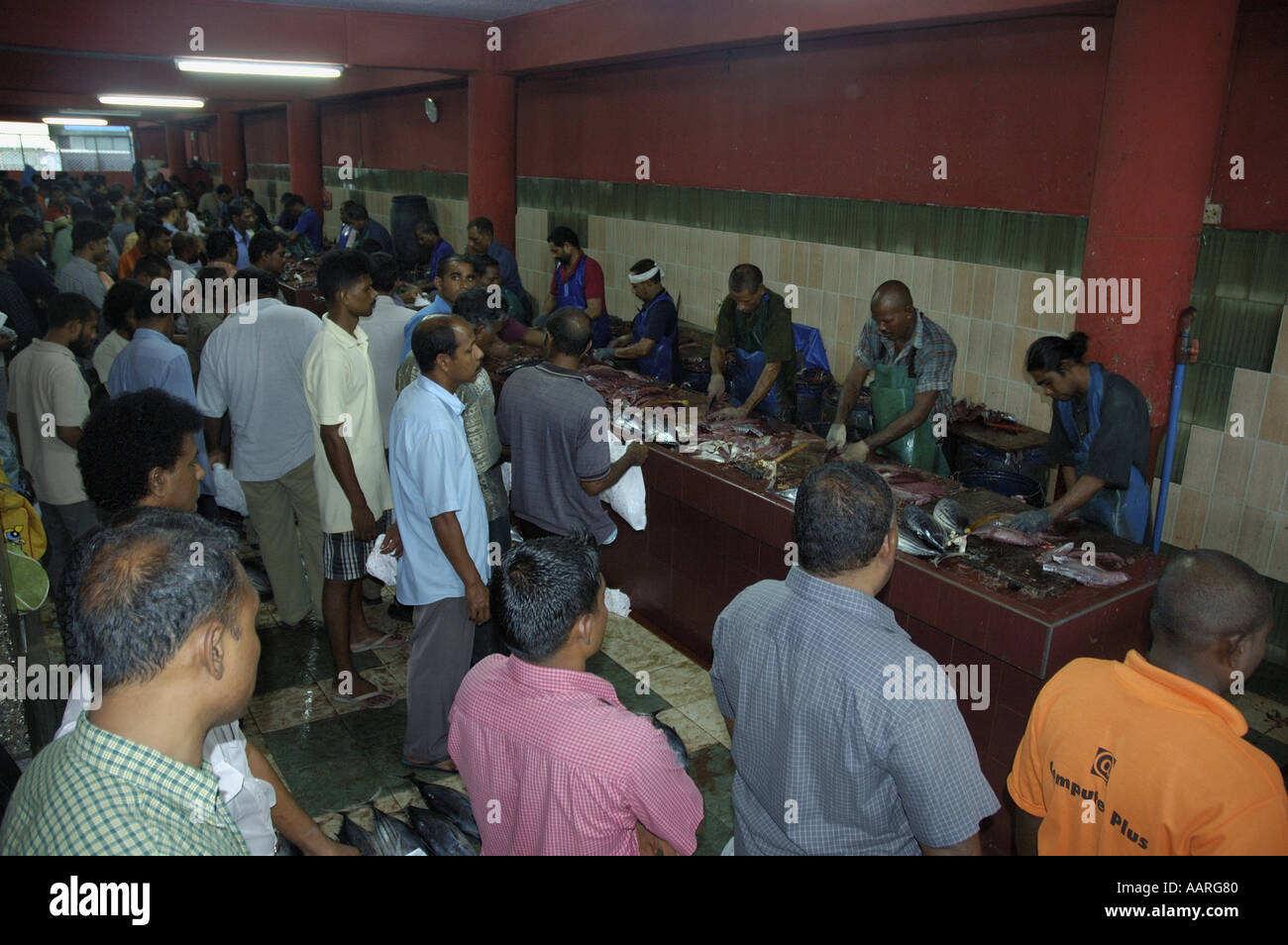 Customers waiting in line at a fish market, Male, Maldives Stock Photo ...