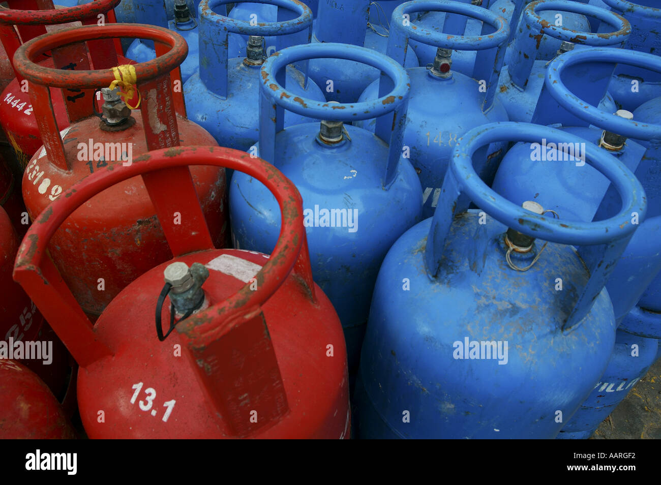 Rows of blue and red domestic gas bottles, Maldives Stock Photo - Alamy