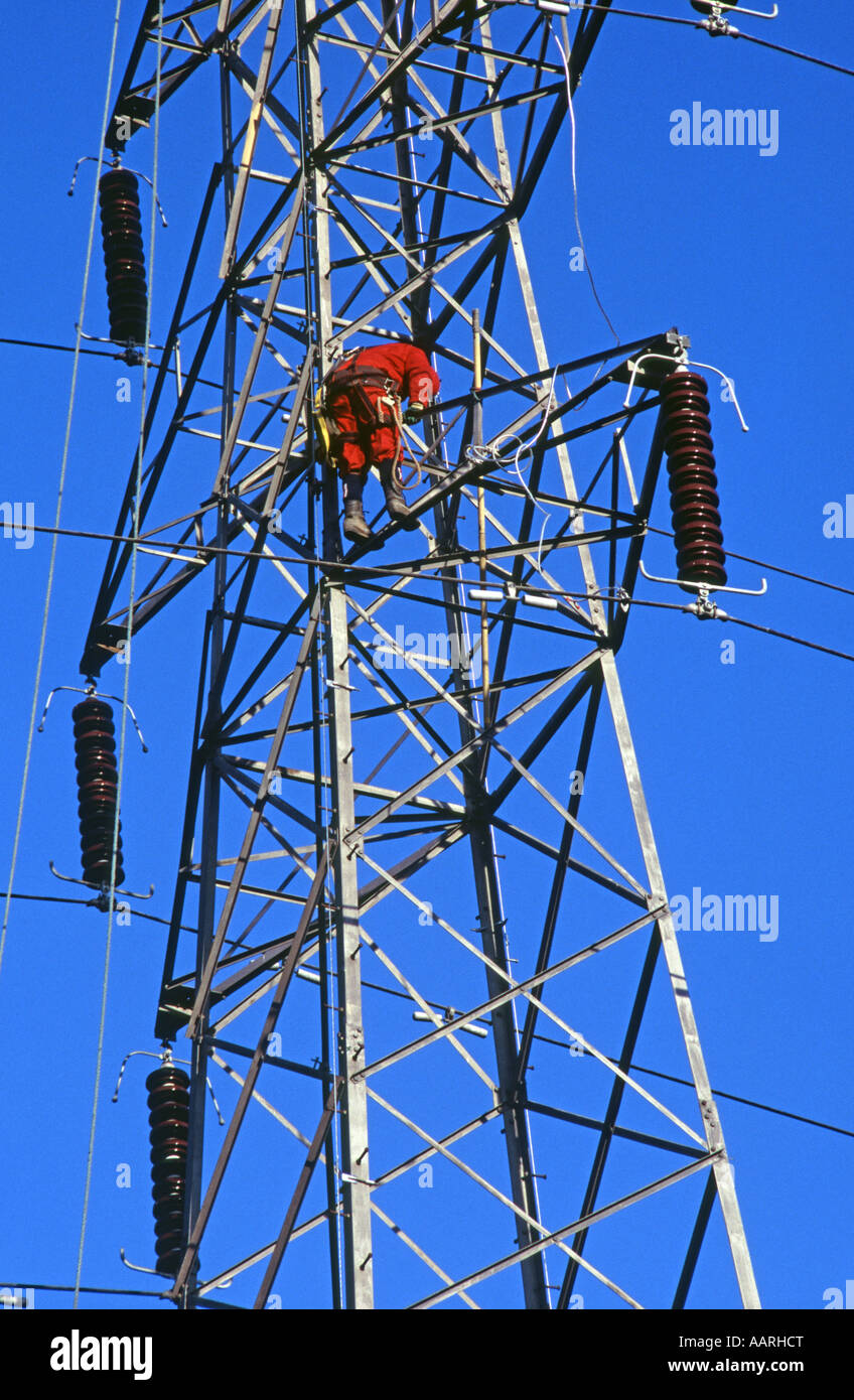 Engineers working on an electricity pylon Stock Photo - Alamy