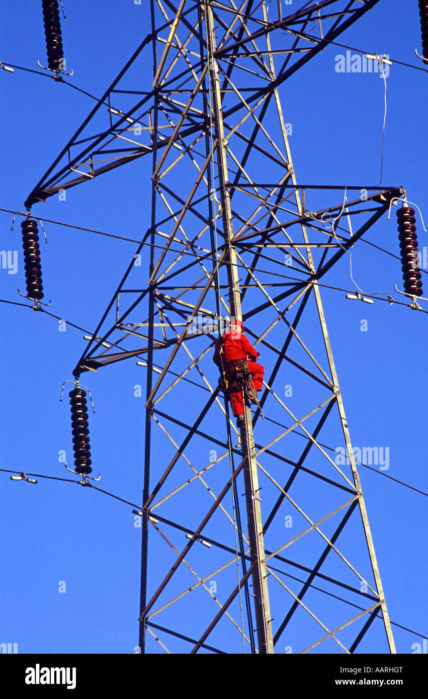 Engineers working on an electricity pylon Stock Photo - Alamy