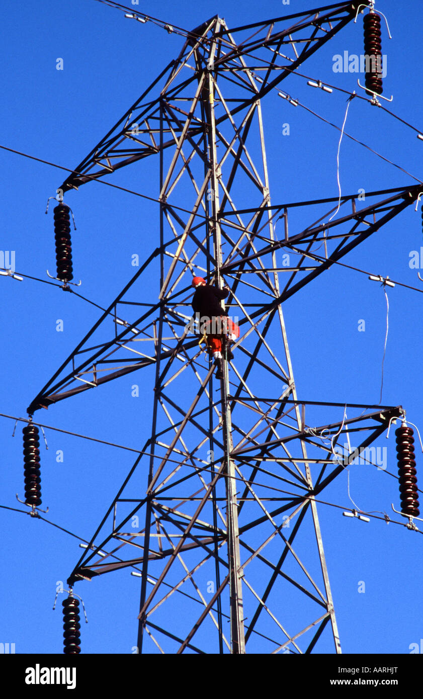 Engineers working on an electricity pylon Stock Photo - Alamy
