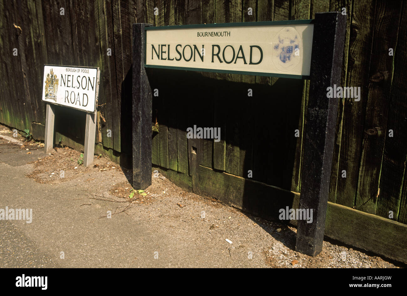 Two road name signs for same road but in adjacent towns Stock Photo - Alamy
