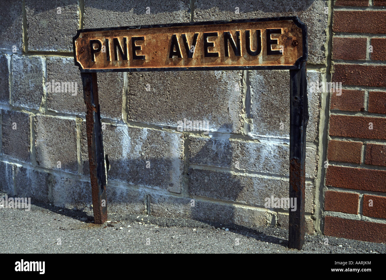 Cast iron road name sign in need of a repaint Stock Photo - Alamy