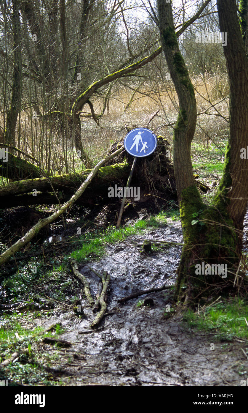 Fallen road sign along a muddy footpath in the middle of nowhere ...