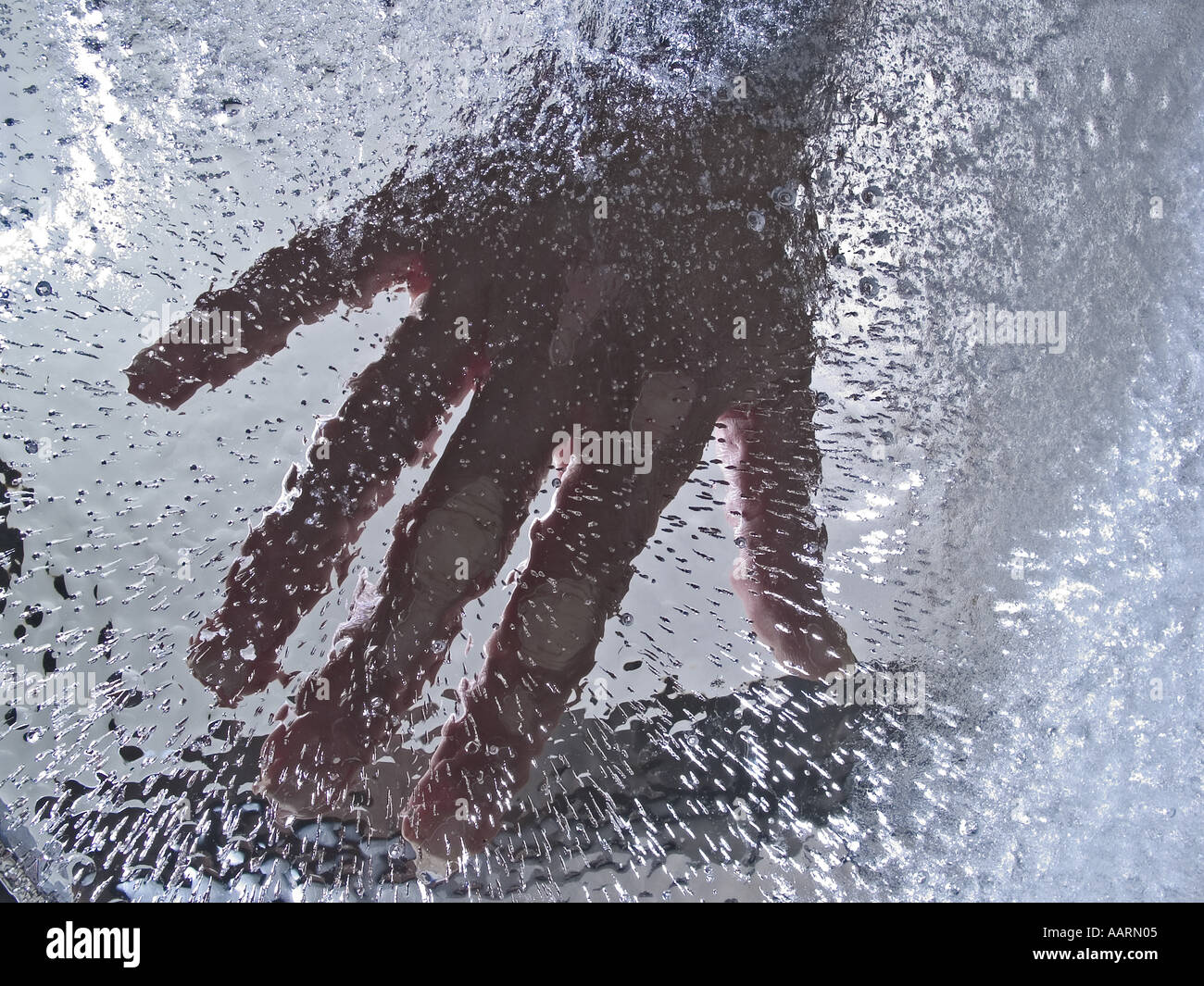 Hand on ice Stock Photo - Alamy