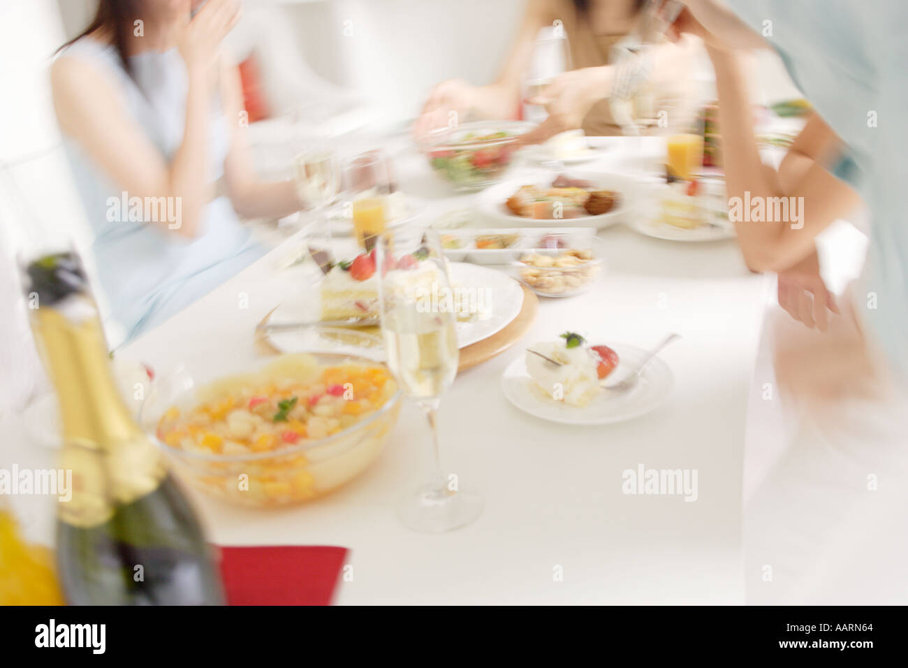 Group people sitting table in hi-res stock photography and images - Alamy
