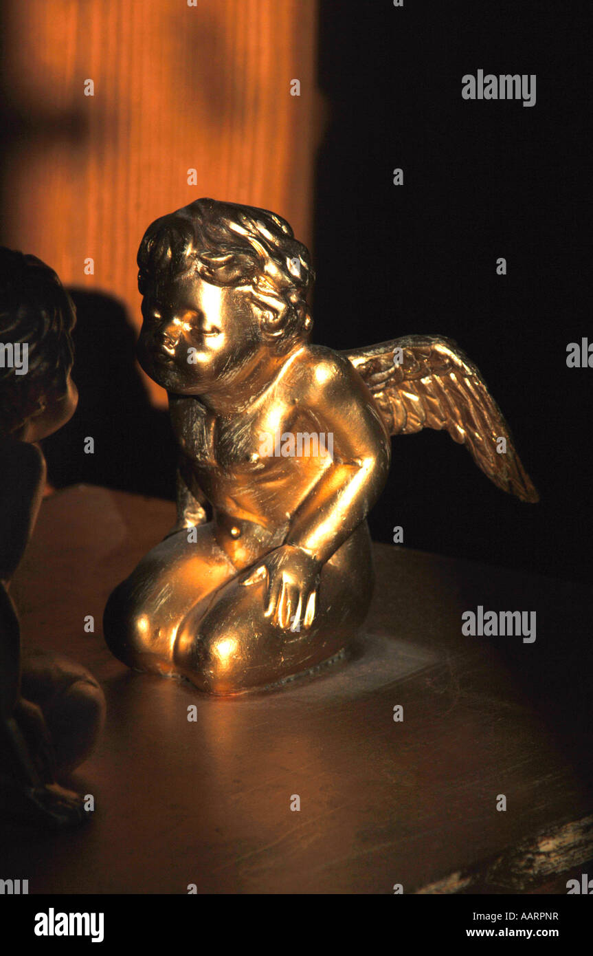 Gold Painted Cherub Angels Stock Photo - Alamy