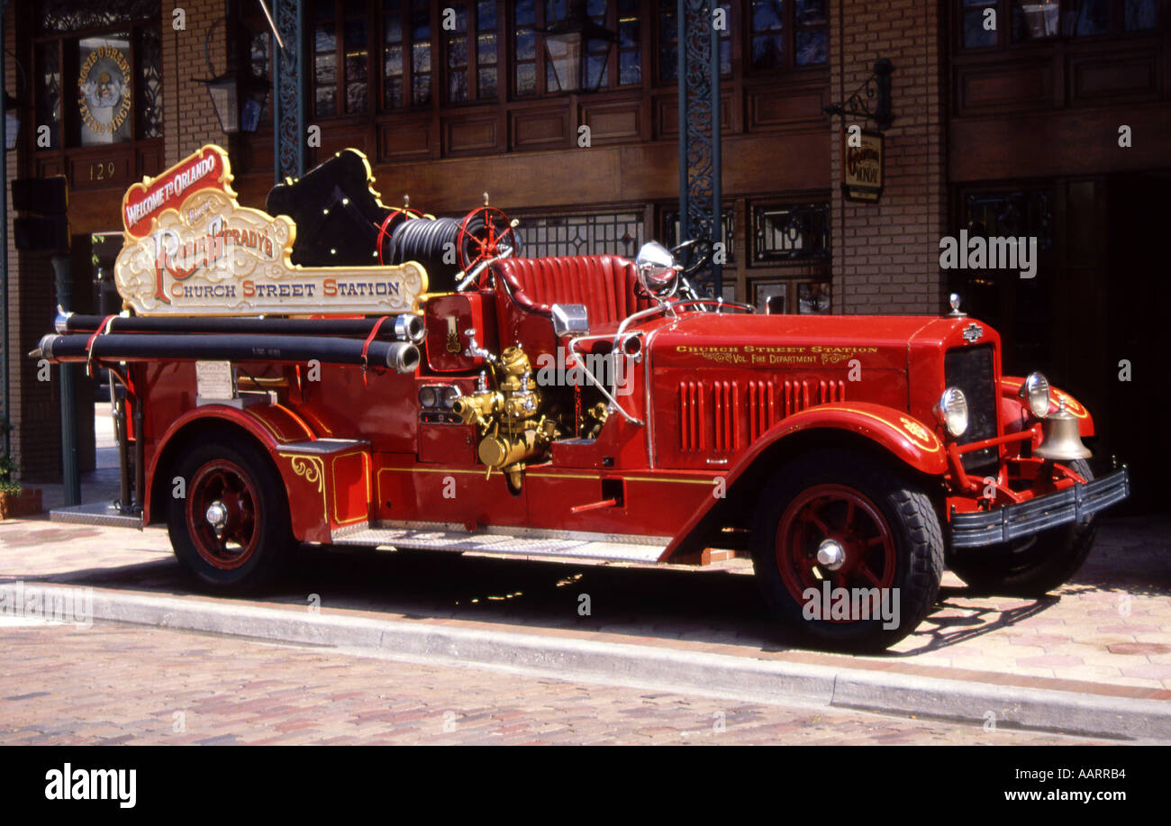 Old red fire engine in Orlando at a night club and entertainment area ...