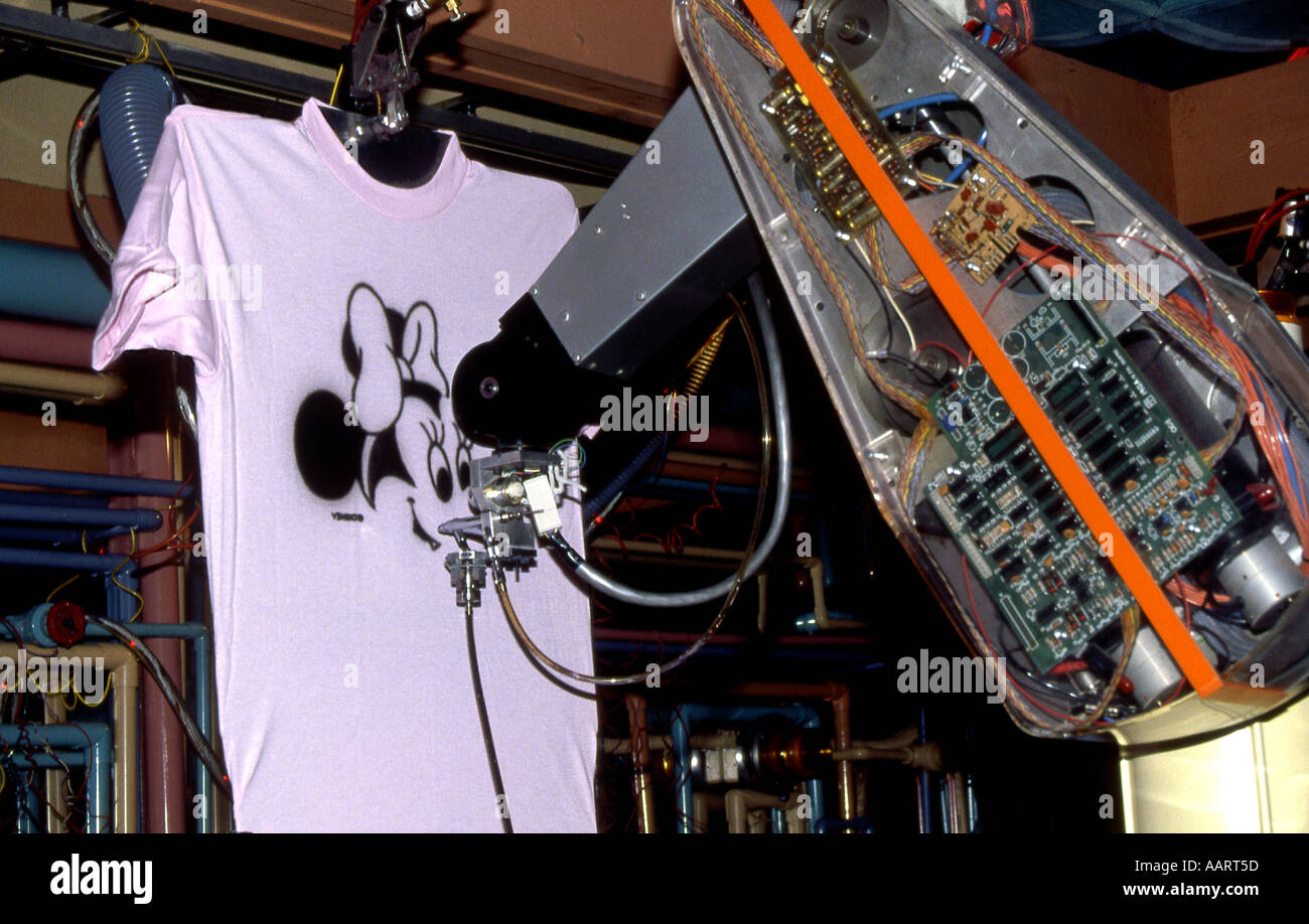 Automatic computer controlled equipment painting T shirts in Disney ...