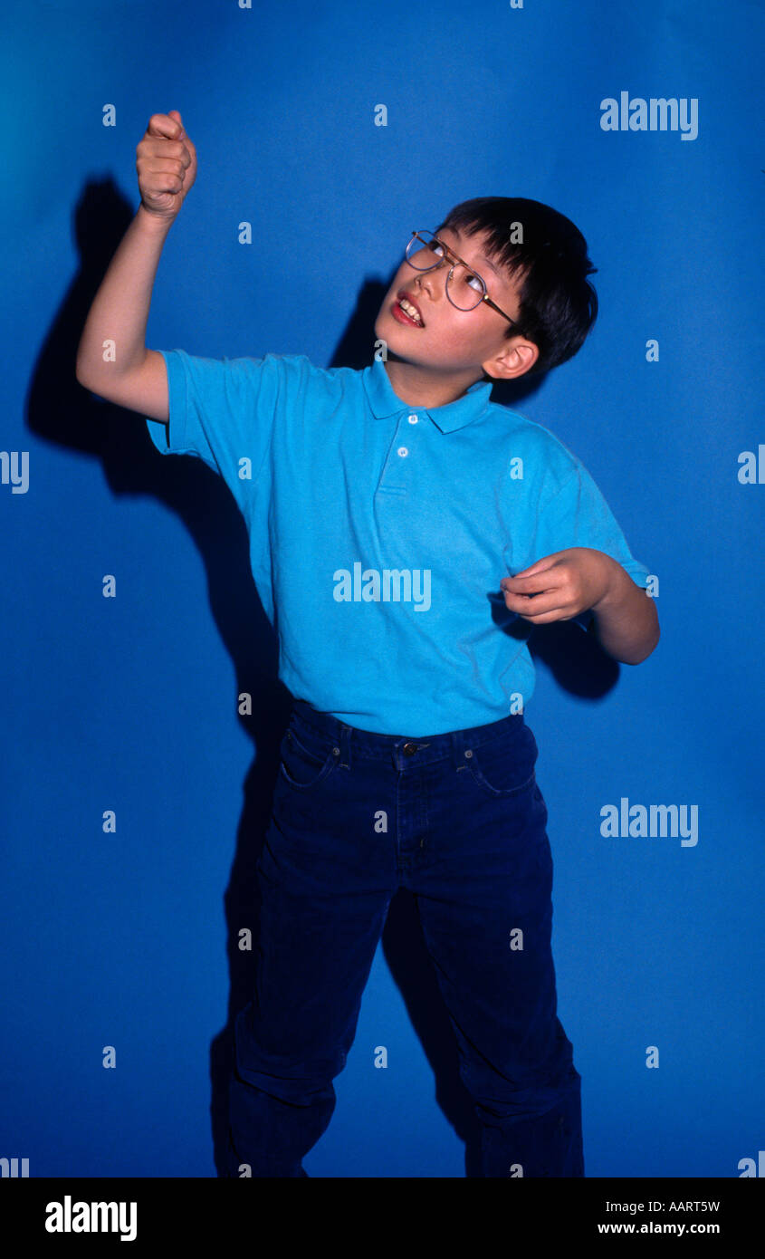 Korean Boy Miming Flying a Kite Stock Photo - Alamy