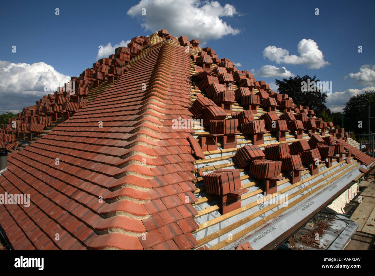 Laying New Roof Tiles on House Stock Photo - Alamy