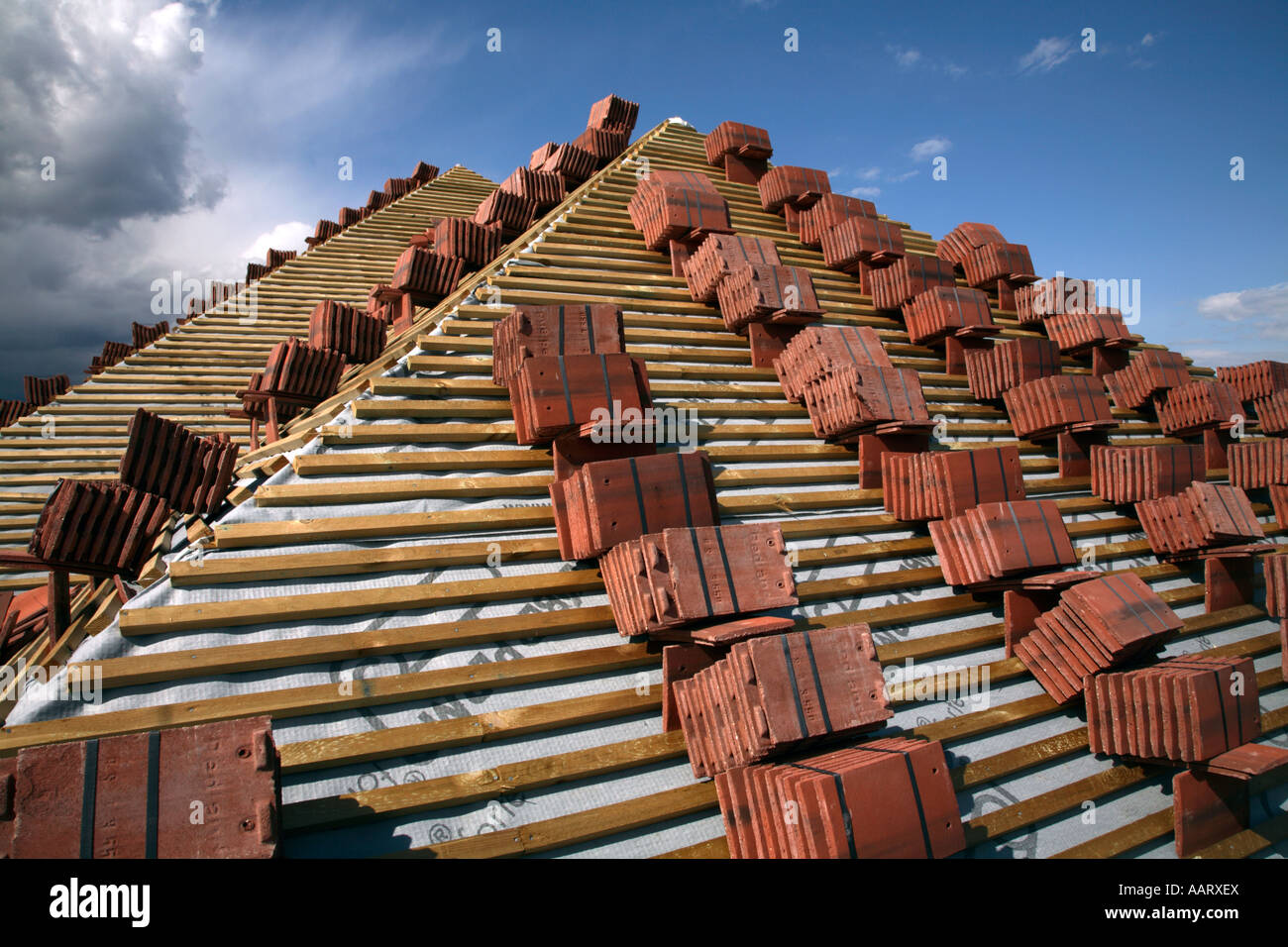 Laying New Roof Tiles on House Stock Photo - Alamy