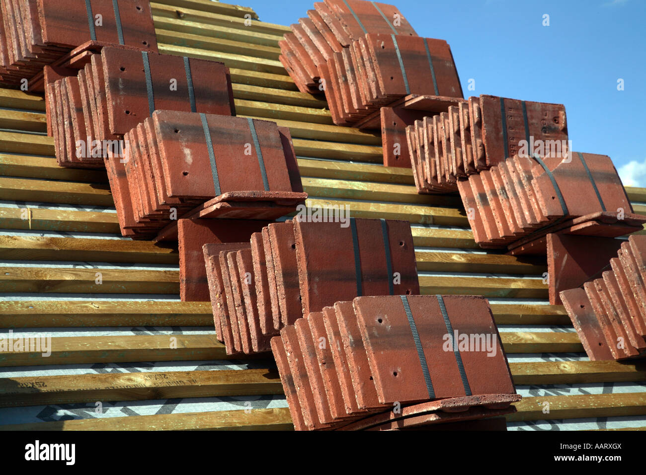 Laying New Roof Tiles on House Stock Photo - Alamy