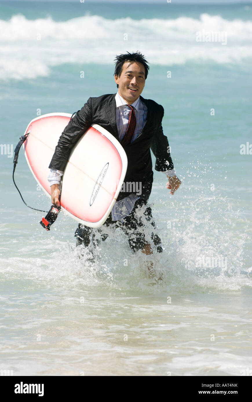 Businessman beach ocean surf water suit hi-res stock photography and ...