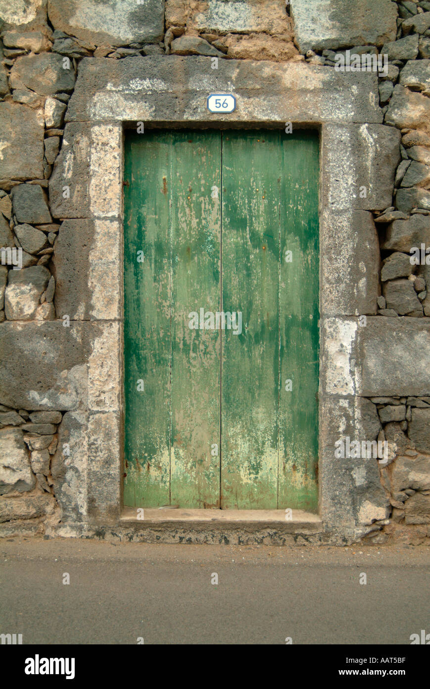 A rustic door in a residential neighborhood in the Azores Stock Photo ...