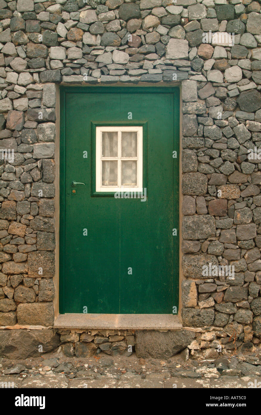 A rustic door in a residential neighborhood in the Azores Stock Photo ...