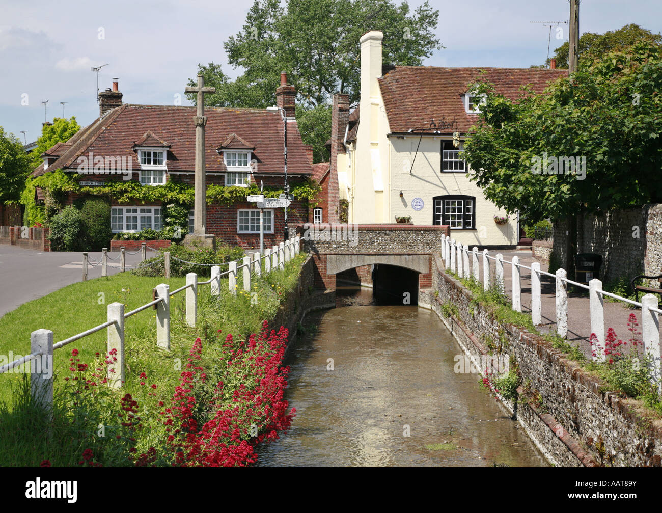 Stream running along the main street in the pretty Hampshire village of ...