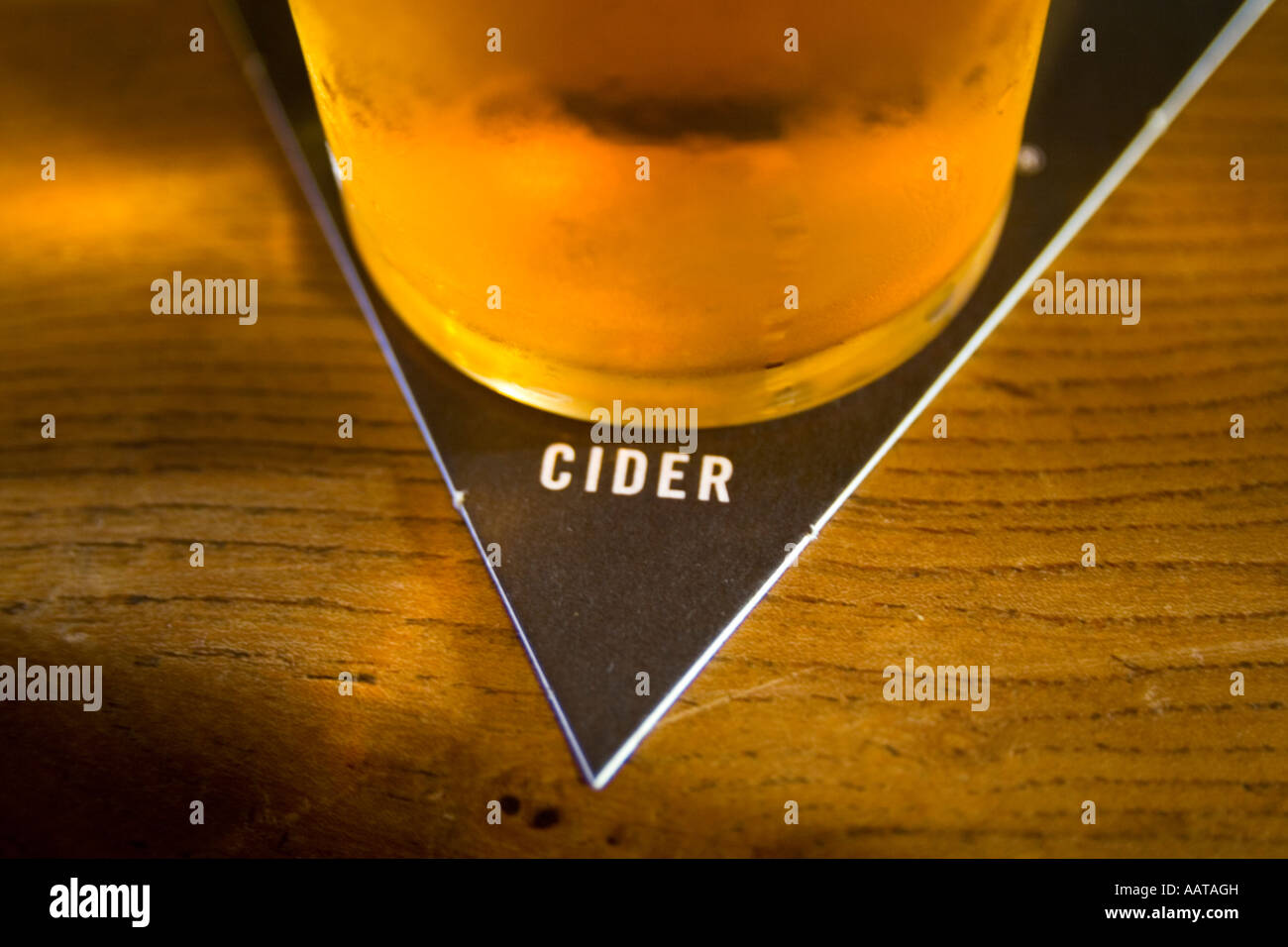 Pint of cider on pub table Stock Photo - Alamy