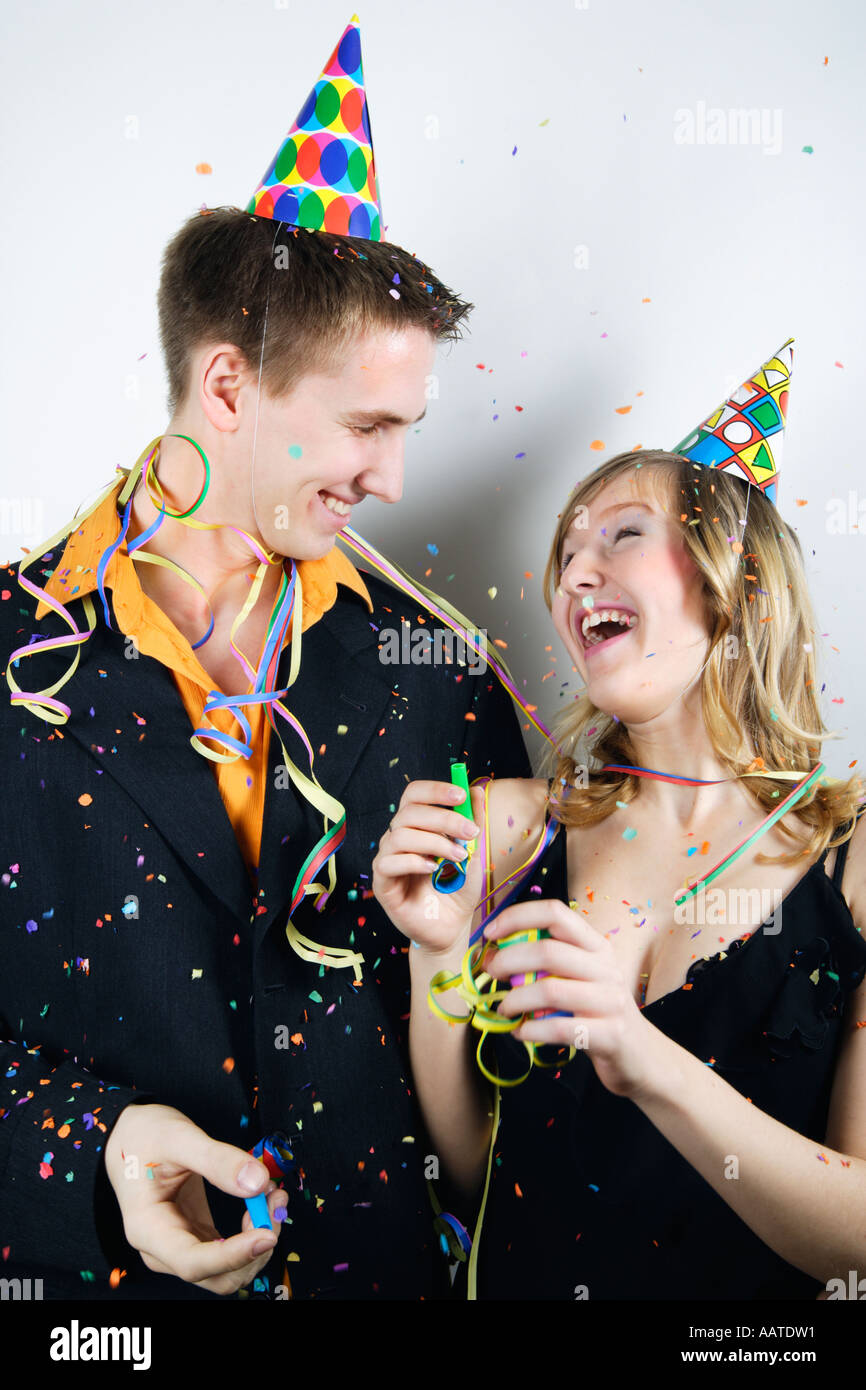 Young couple having fun at a party Stock Photo - Alamy
