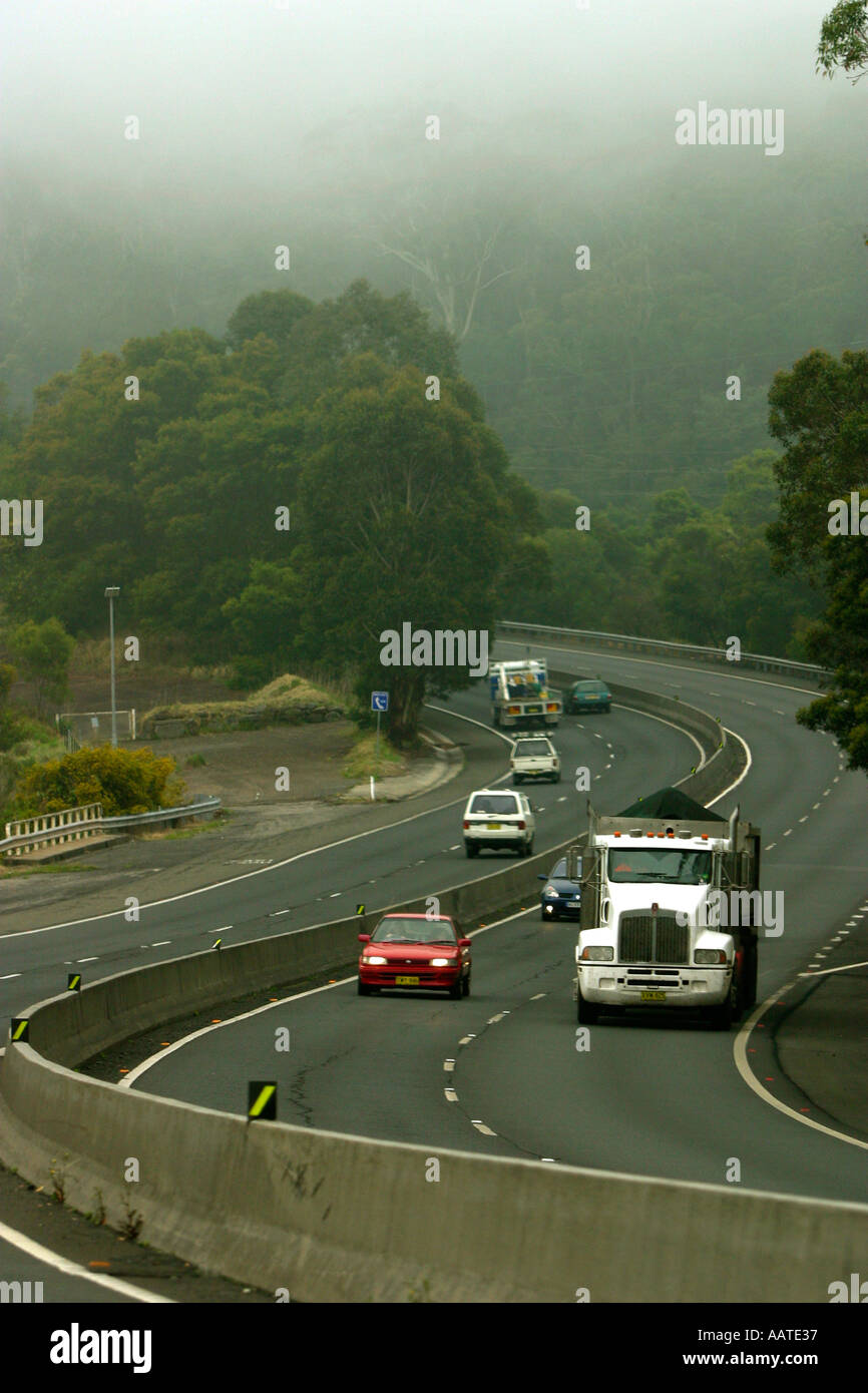 Highway traffic in fog Stock Photo - Alamy