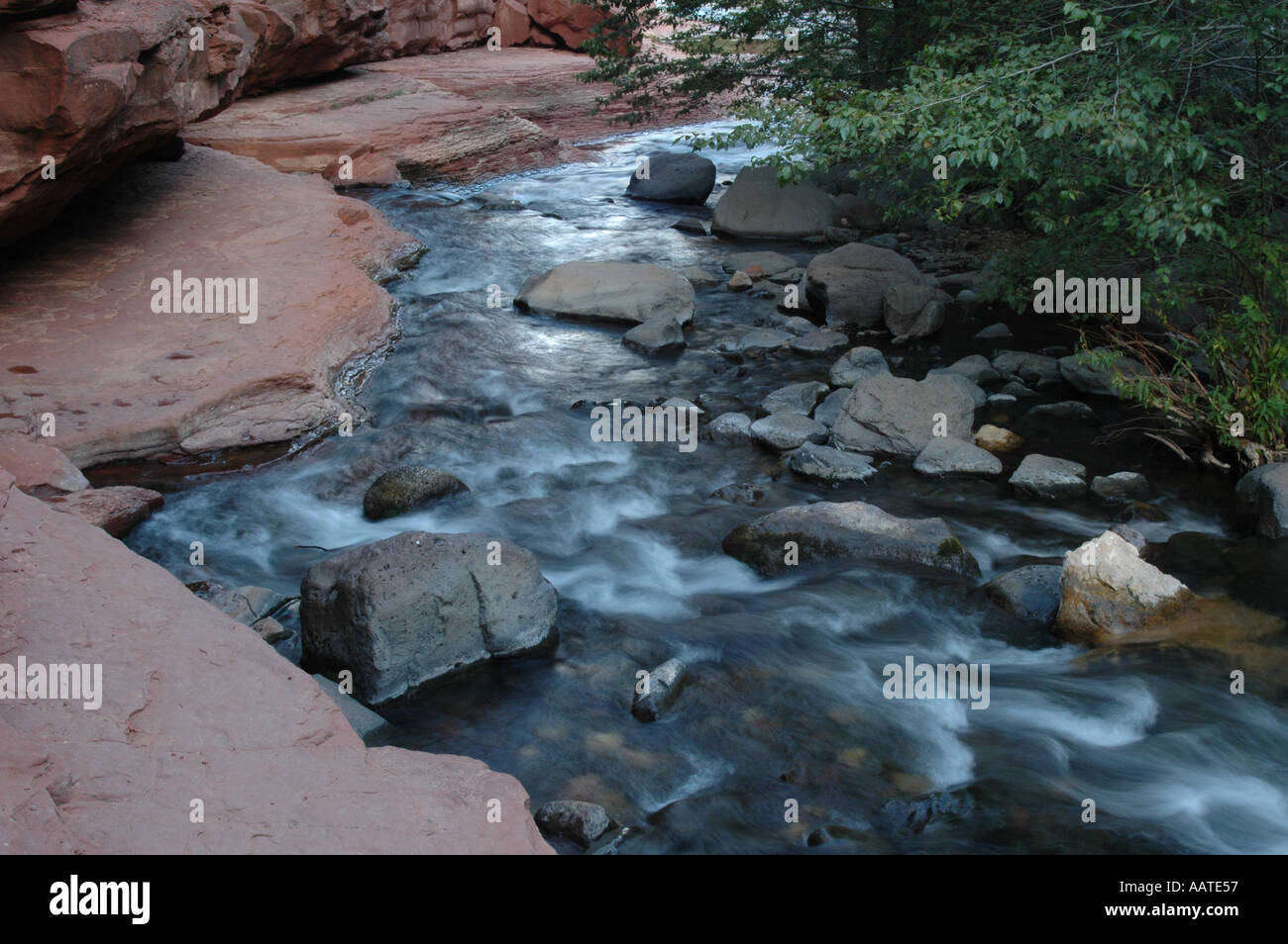 Rocks in flowing stream Stock Photo - Alamy