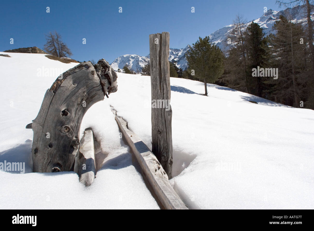 Frozen water fountain and trough, Alps, Italy Stock Photo - Alamy