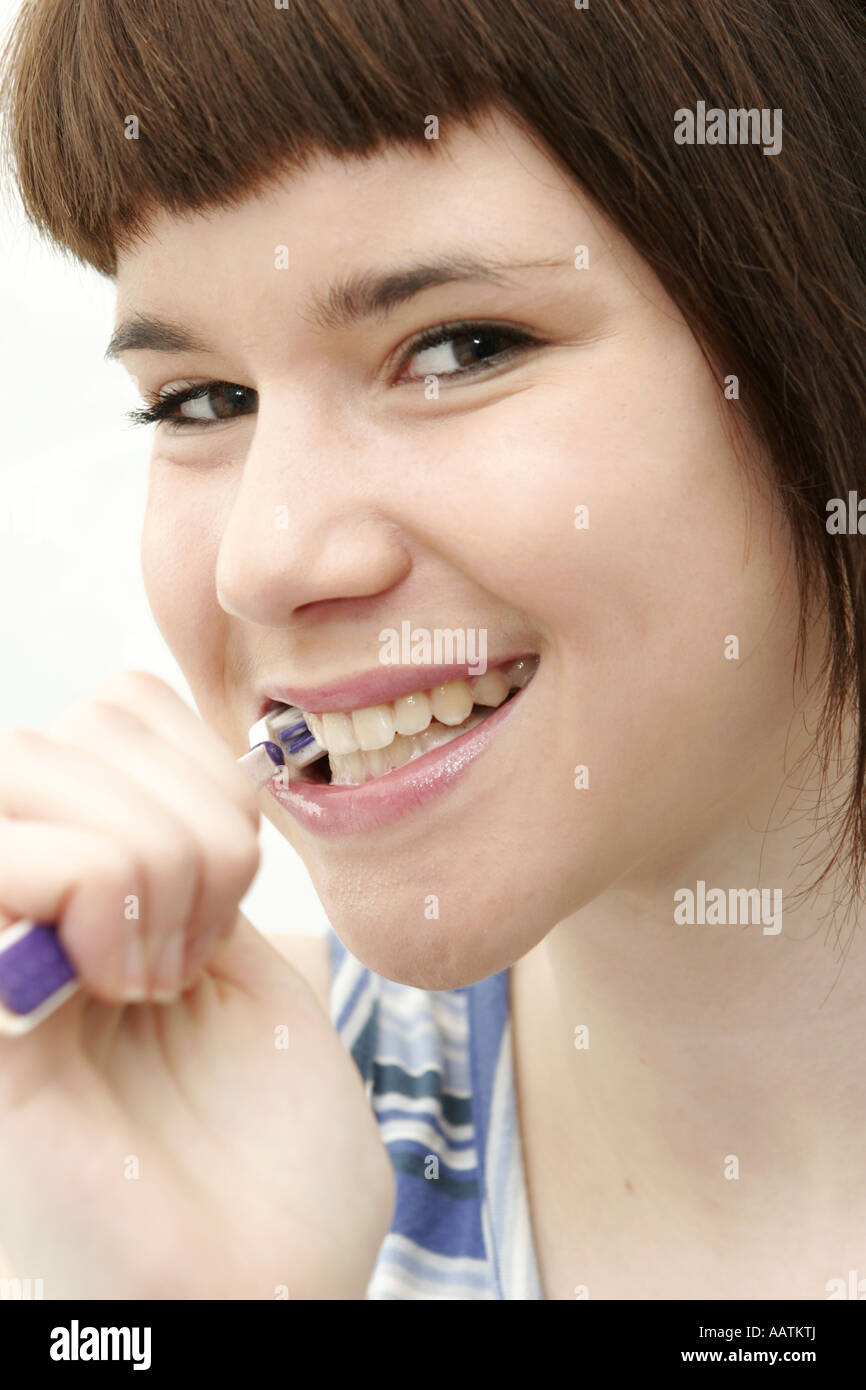 Teenage Girl Cleaning Her Teeth Stock Photo - Alamy